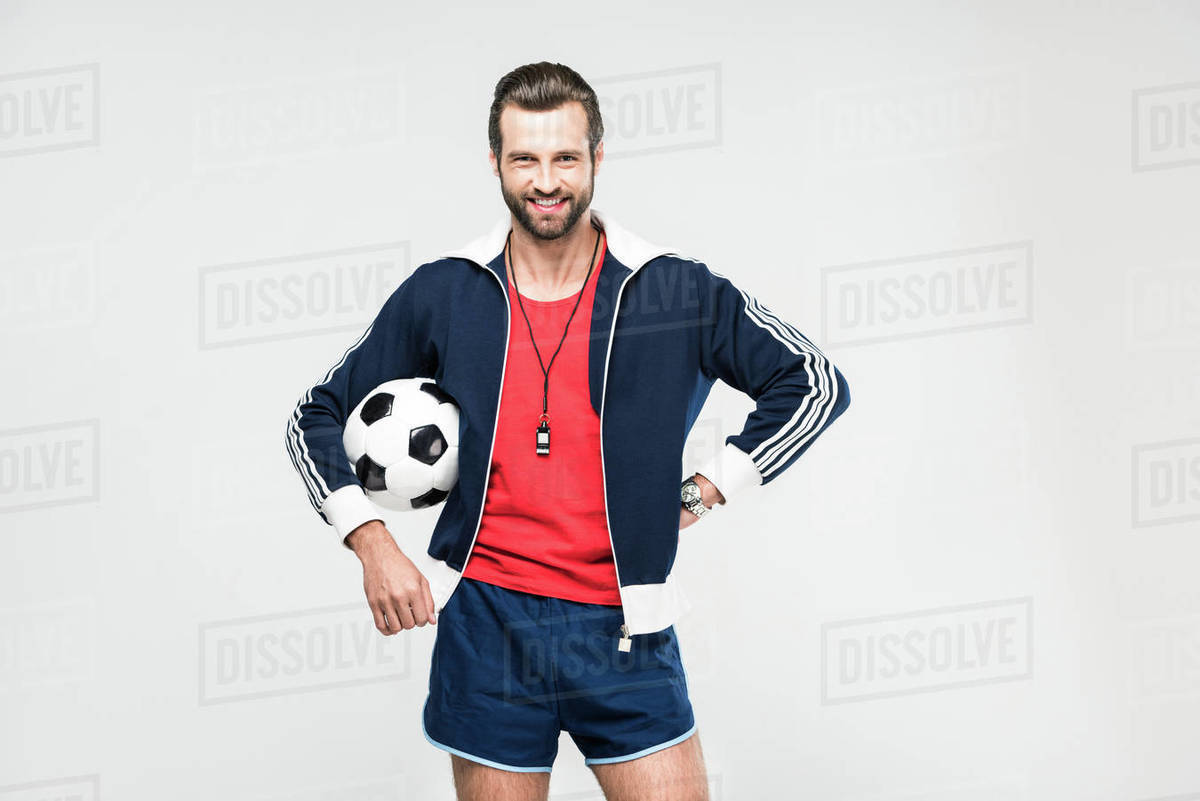 Cheerful soccer coach with whistle and ball, isolated on white - Stock ...