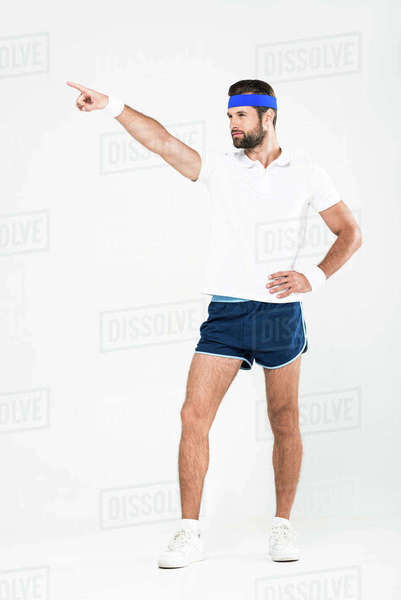 Handsome sportsman posing in retro sportswear, isolated on white ...
