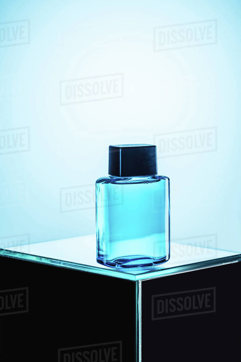 Mens fragrance in blue spray bottle, on blue - Royalty-free Stock Photo ...