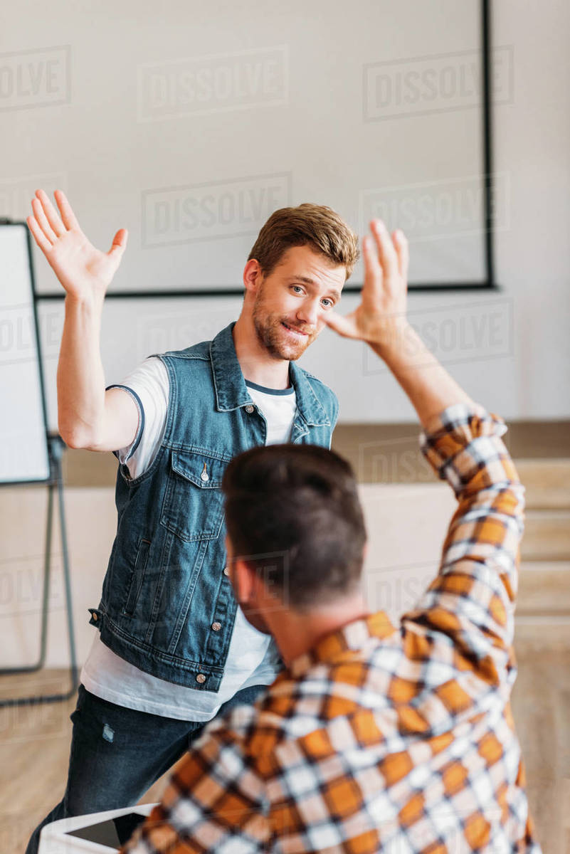 Successful young students giving high five at college - Stock Photo ...
