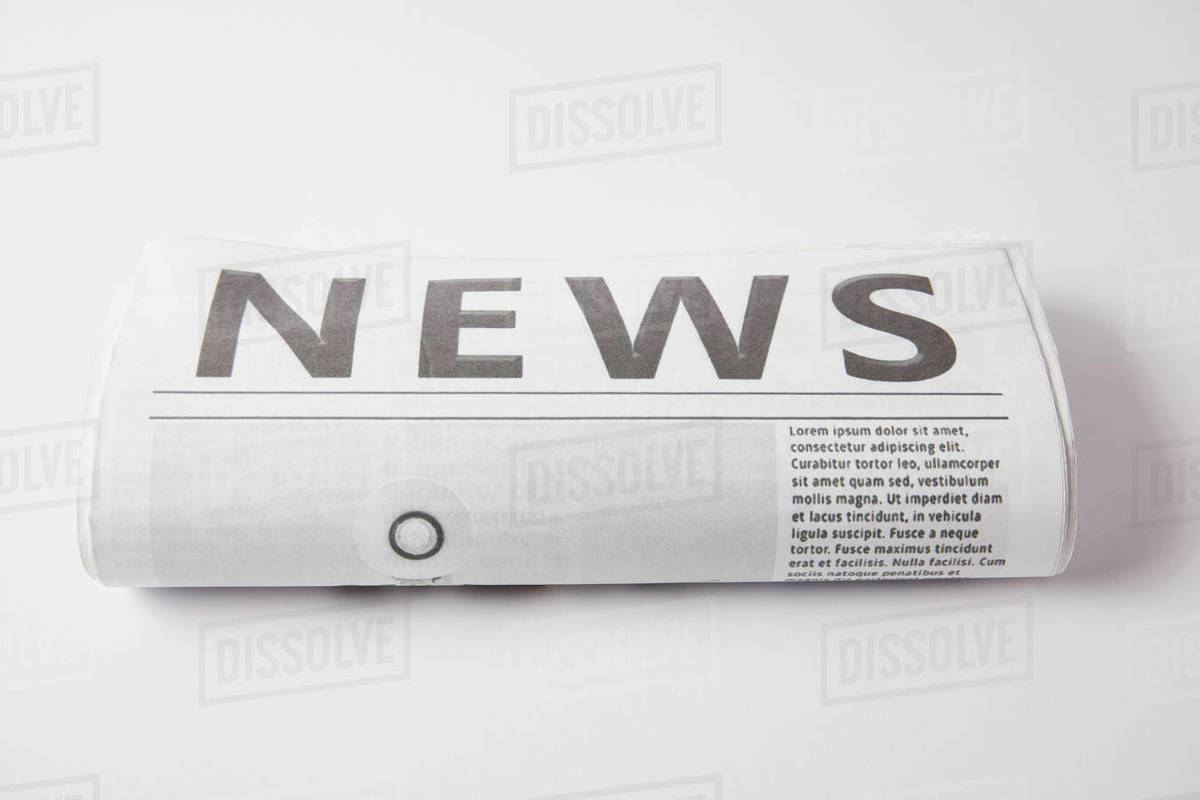 One rolled newspaper with information, on white background - Stock ...