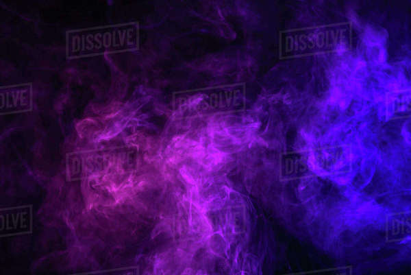 Violet smoke on black background with copy space - Stock Photo - Dissolve