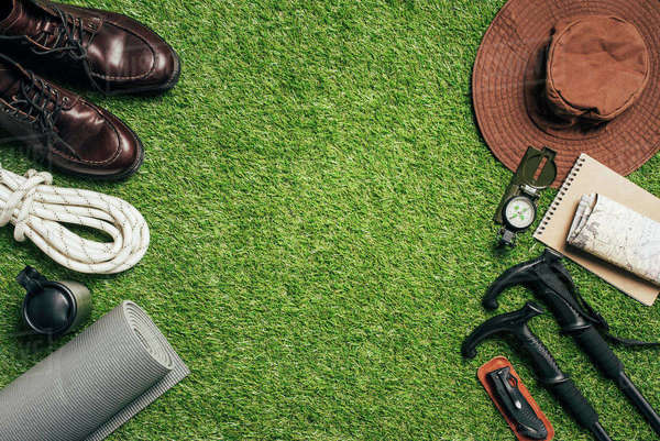 flat lay with traveler set on green grass - Royalty-free Stock Photo ...