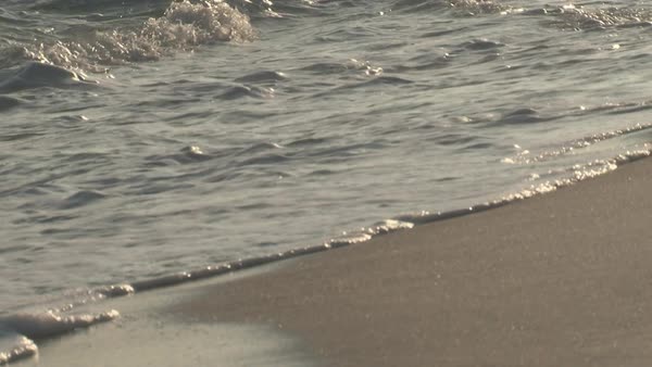 Close-up shot of waves crashing against the shore of a beach. - HD ...