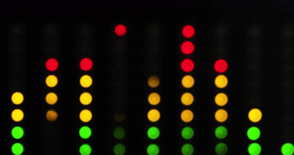 Close-up clear view of the audio level lights bouncing up and down as ...