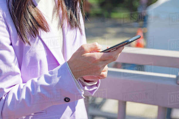 Body parts of hands using smartphne by Japanese woman at the street ...