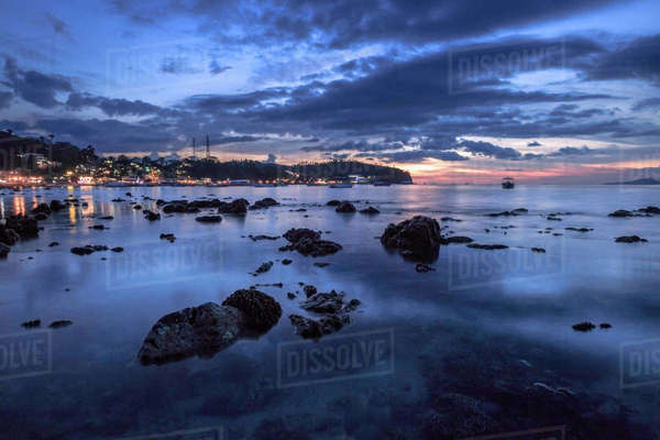 Coastal rocky beach landscape at sunset, Batangas, Calabarzon ...