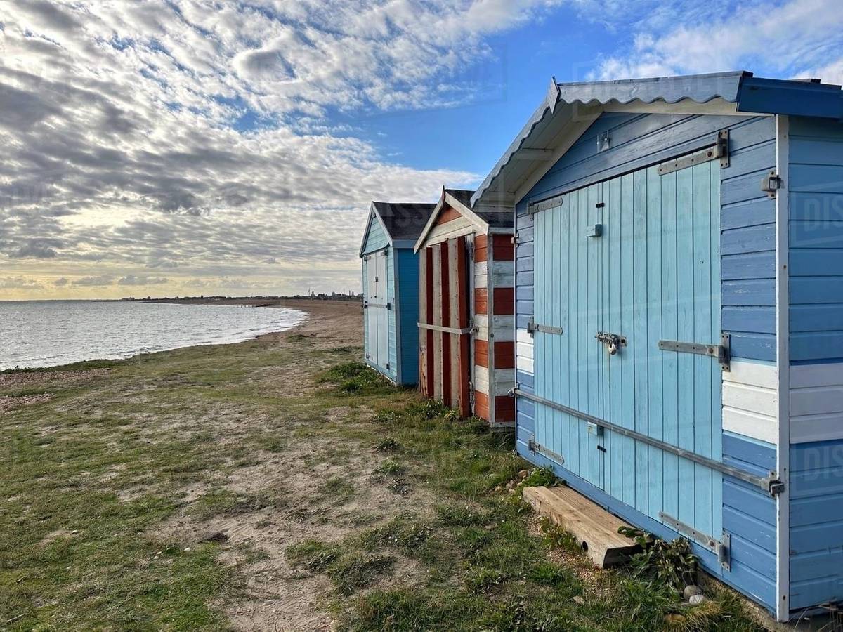 Three beach huts by the sea in autumn, Hayling Island, Havant ...