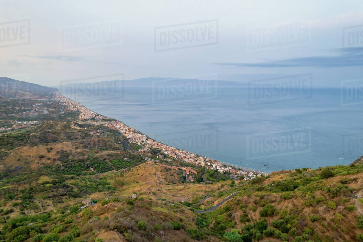 Aerial view of coastal village landscape from Taormina with Calabria in ...