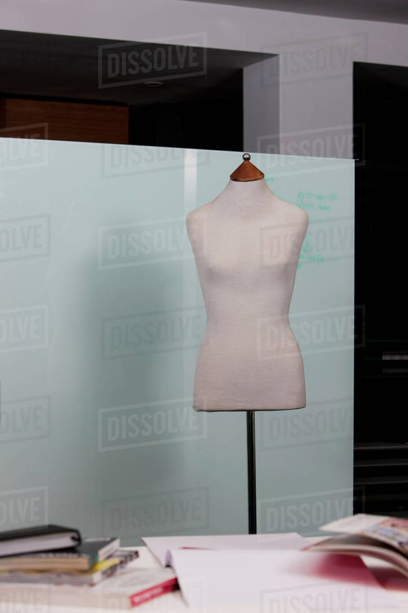 Dressmakers mannequin in a studio - Stock Photo - Dissolve
