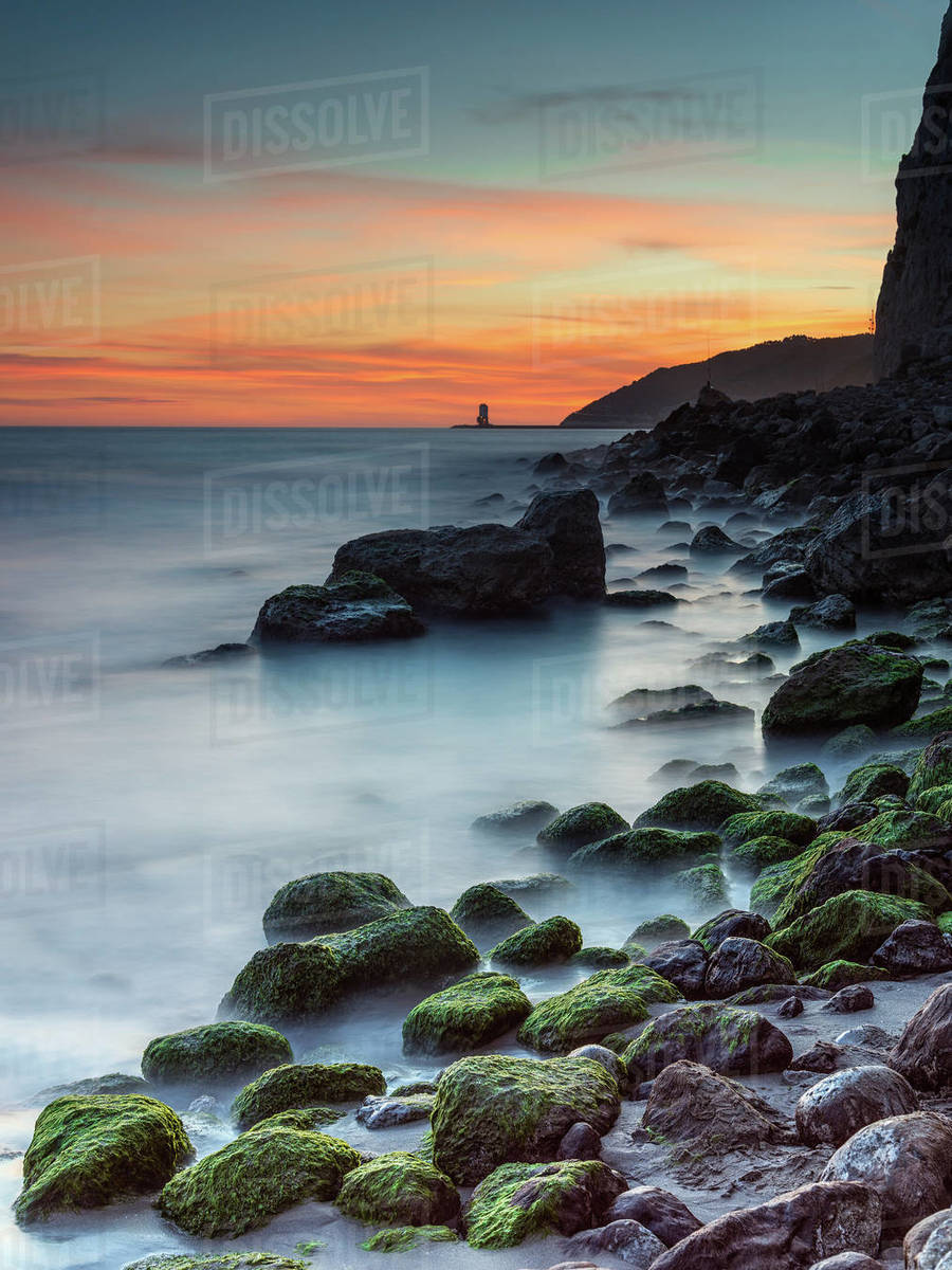 Coastline at sunset, Garraf, Barcelona, Spain - Stock Photo - Dissolve