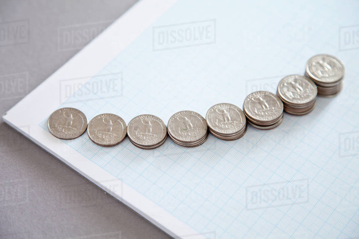 American coins on graph paper - Royalty-free Stock Photo | Dissolve