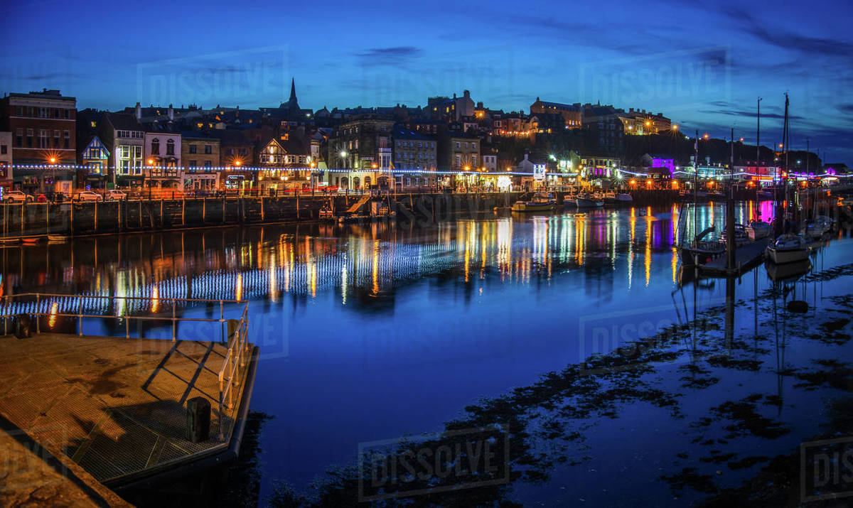 Whitby harbour waterfront at dusk, Scarborough, North Yorkshire ...