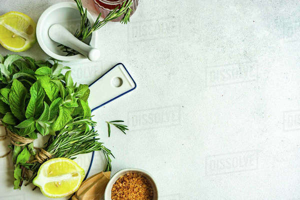 Overhead view of ingredients for making fresh lemonade on a table ...