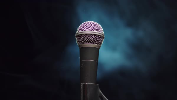 Microphone close-up, mic with smoke and black background. Karaoke ...