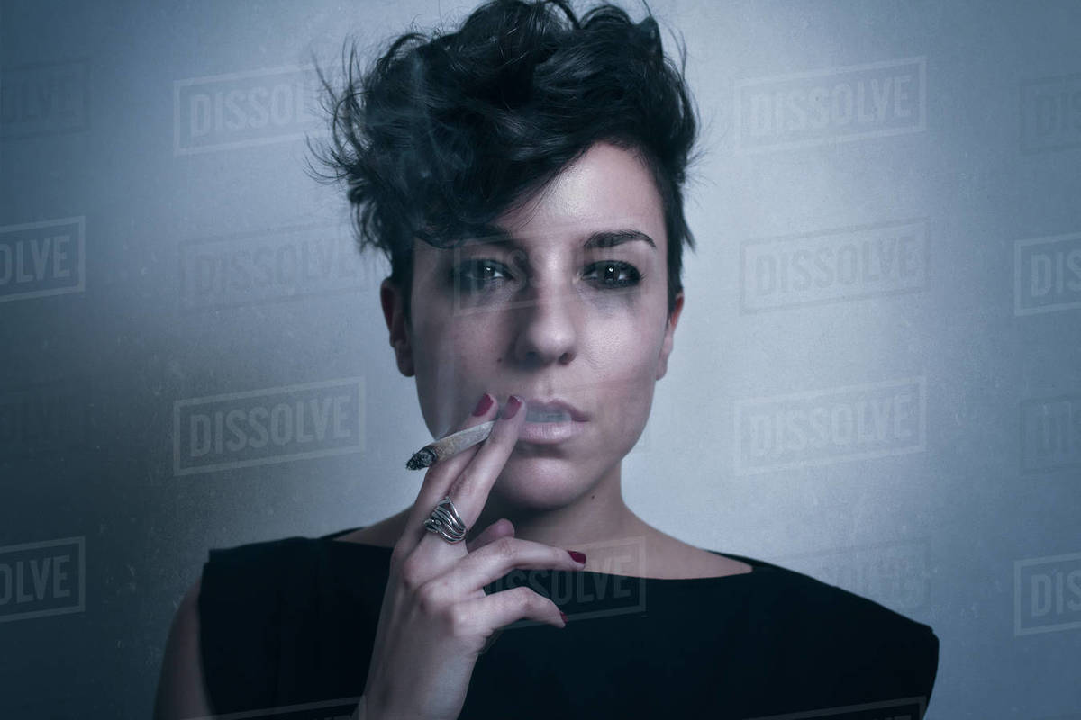 Unhappy pensive crying female with dark short hair and in black clothes ...