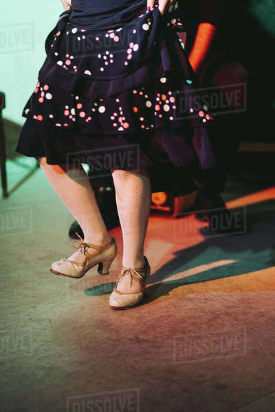 Crop anonymous female flamenco dancer on stage - Stock Photo - Dissolve