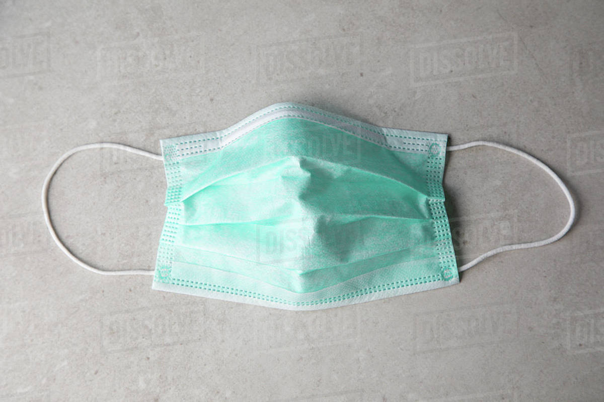 Top view of disposable face mask placed on table in hospital as means ...