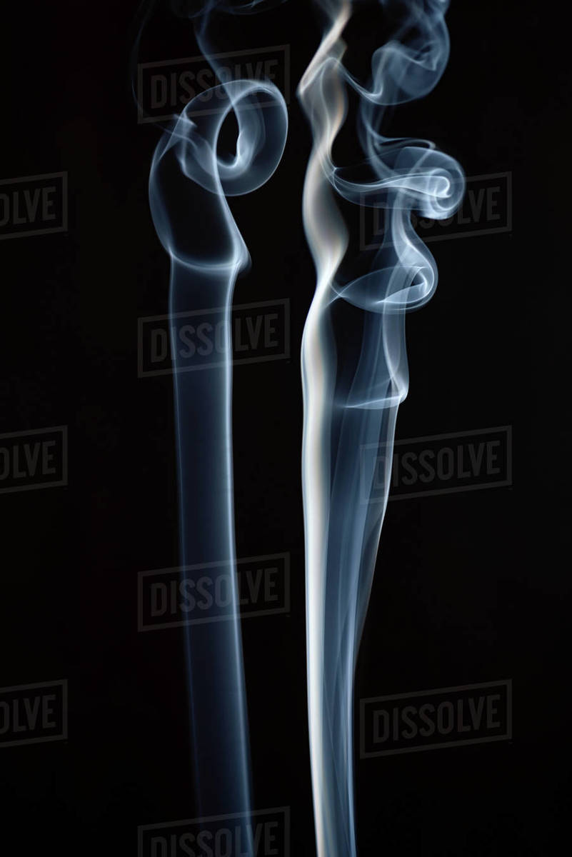 Hot steam rising up on black background - Stock Photo - Dissolve