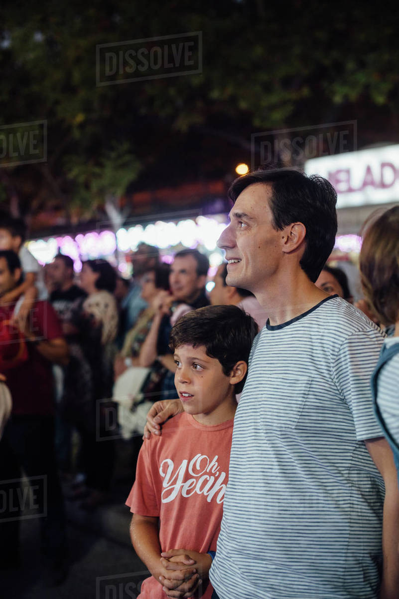 Cheerful family on fairground in city - Royalty-free Stock Photo | Dissolve