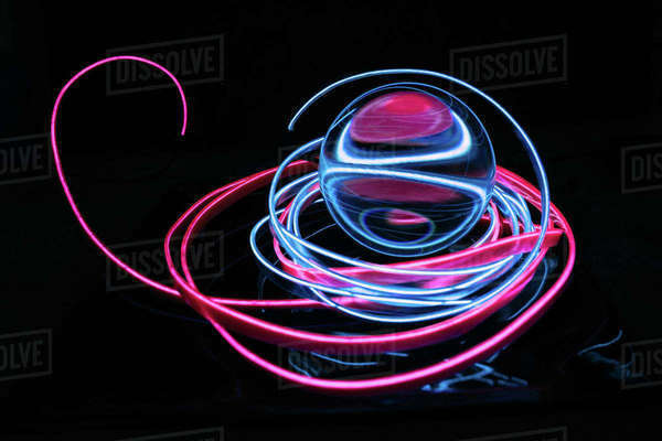 Neon ball wrapped in light tubes - Stock Photo - Dissolve