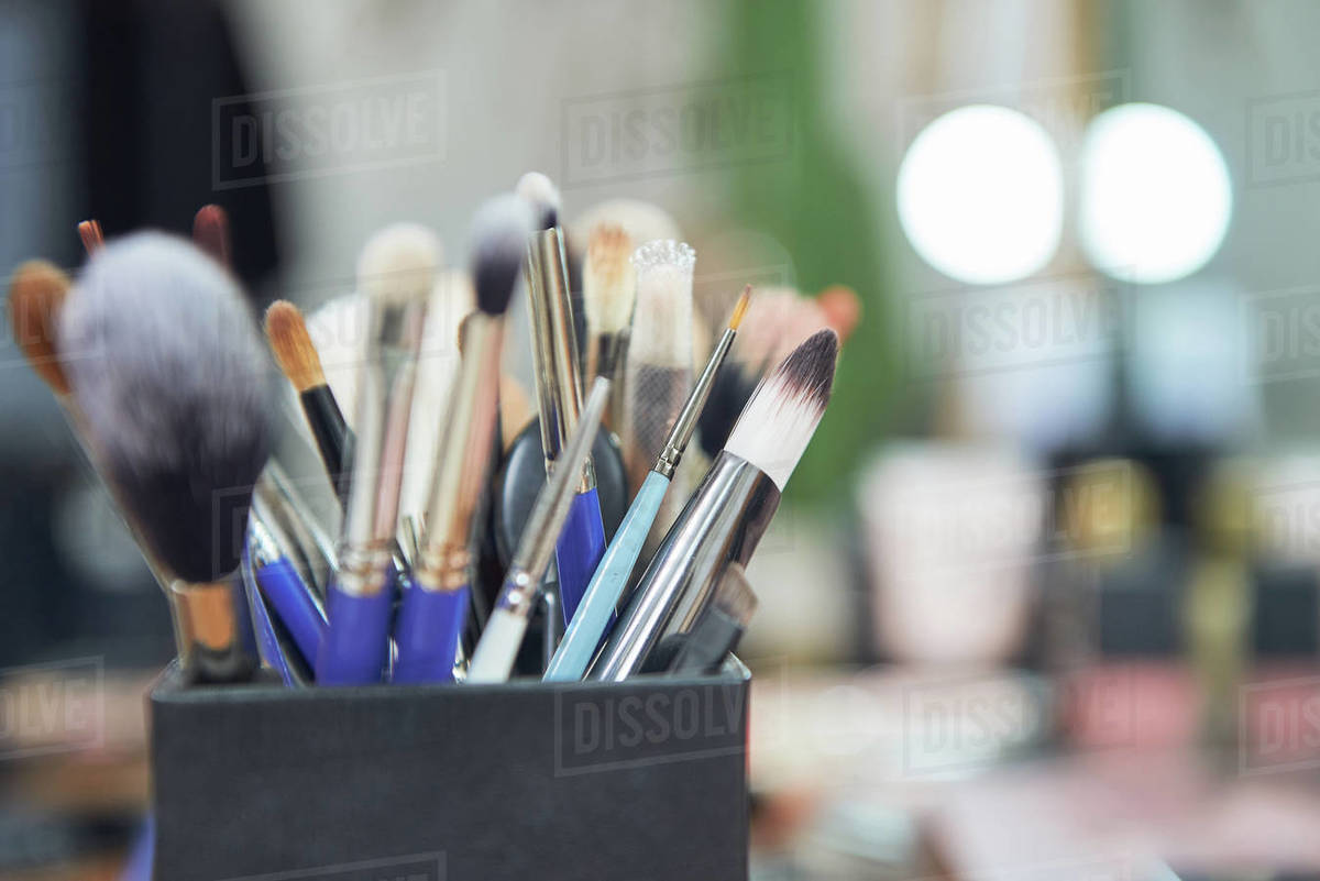 Professional assorted makeup brushes of different size placed in black ...