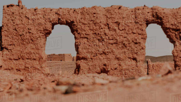 Exterior of aged traditional sandstone building with shabby walls and ...