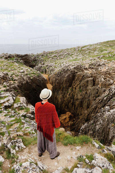 High angle back view of unrecognizable female traveler in stylish ...