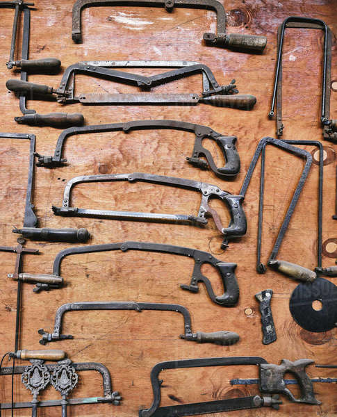 Top view of various aged metal hacksaws for craft work arranged on ...