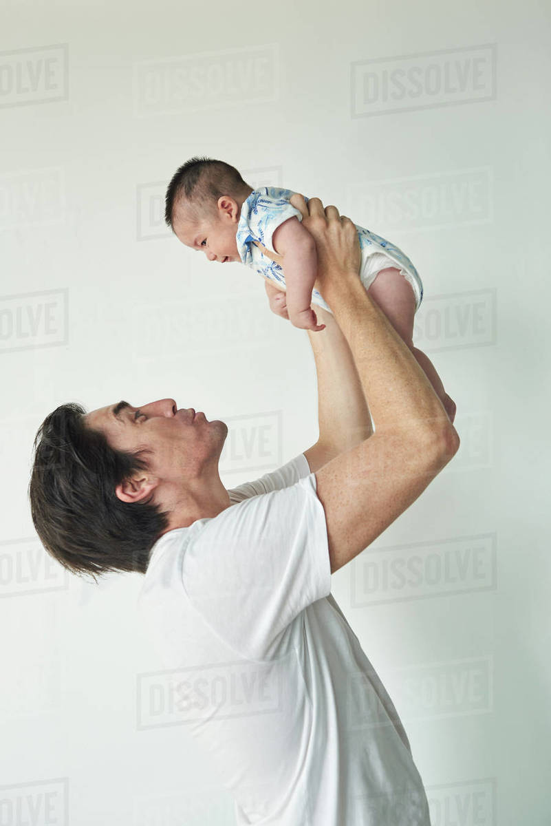 Dad lifting up his baby and having fun together - Royalty-free Stock ...