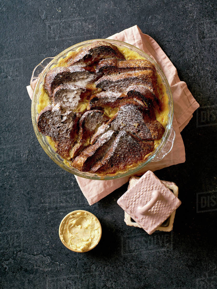 Top view of traditional bread pudding with custard, served with ...
