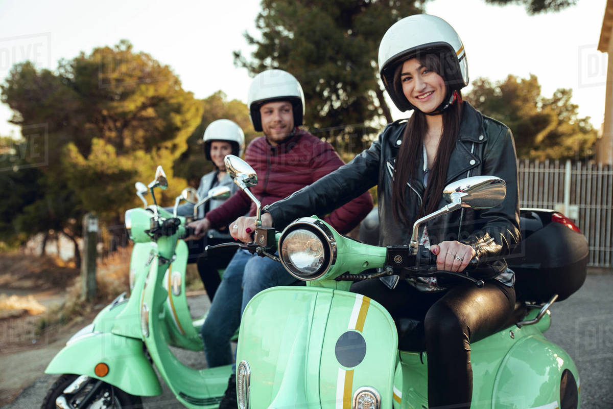 Group of young attractive people looking at camera smiling and sitting ...