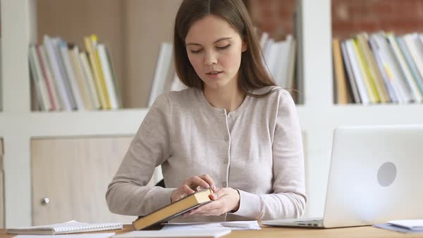 Young focused girl college university school student study in library ...
