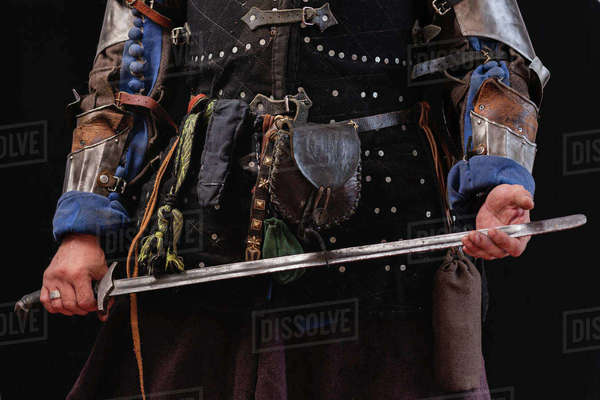 Close-up portrait of a medieval knight with two sword and with a ...