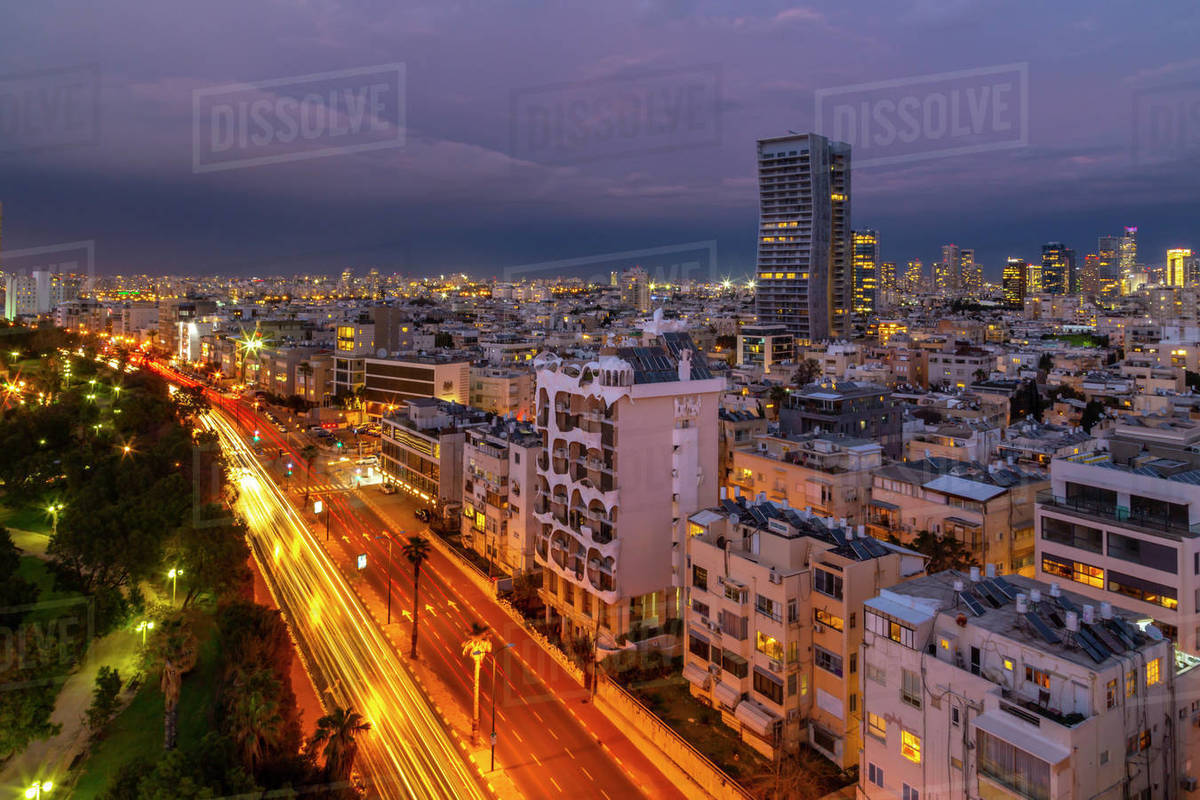 Elevated view of trail lights and Tel Aviv skyline at dusk, Jaffa ...