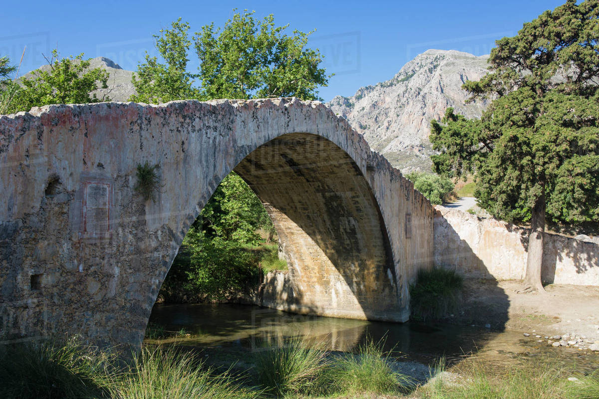 Ancient stone bridge over the Megalopotamos River, Preveli, near ...