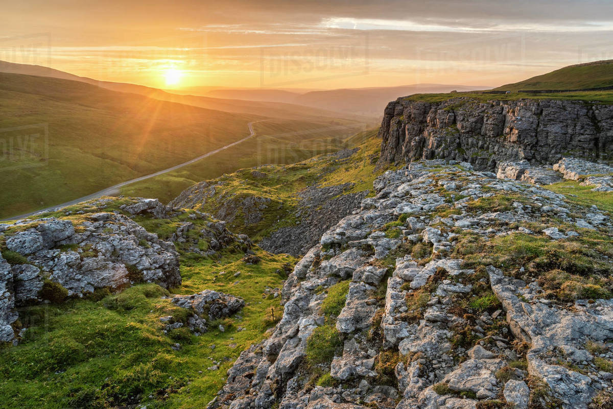Limestone escarpment looking towards Oxnop Ghyll, at sunset, Yorkshire ...
