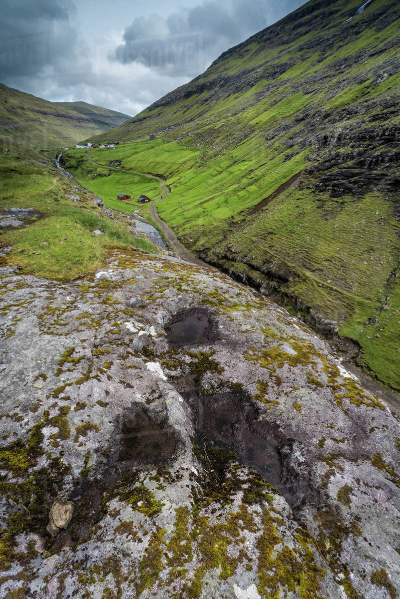 Lichen covered rock and valley, Saksun, Faroe Islands, Denmark ...