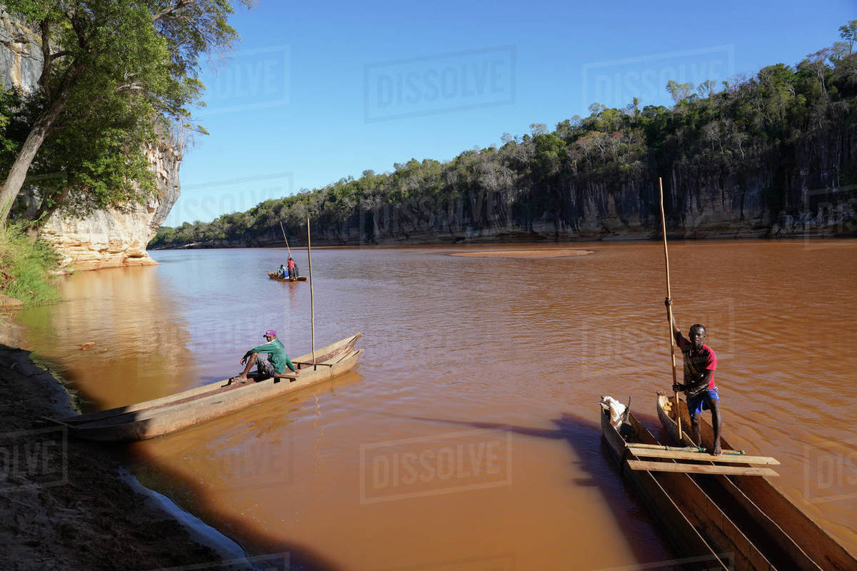 Pirogue excursion along Manambolo river crossing Tsingy de Bemaraha ...