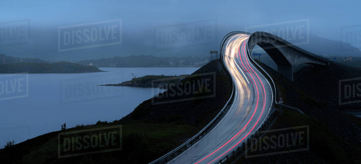 Car lights trails on Storseisundet Bridge along the Atlantic Road, More ...