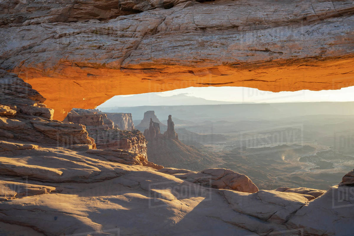 Close up view of canyon through Mesa Arch with glowing arch ...
