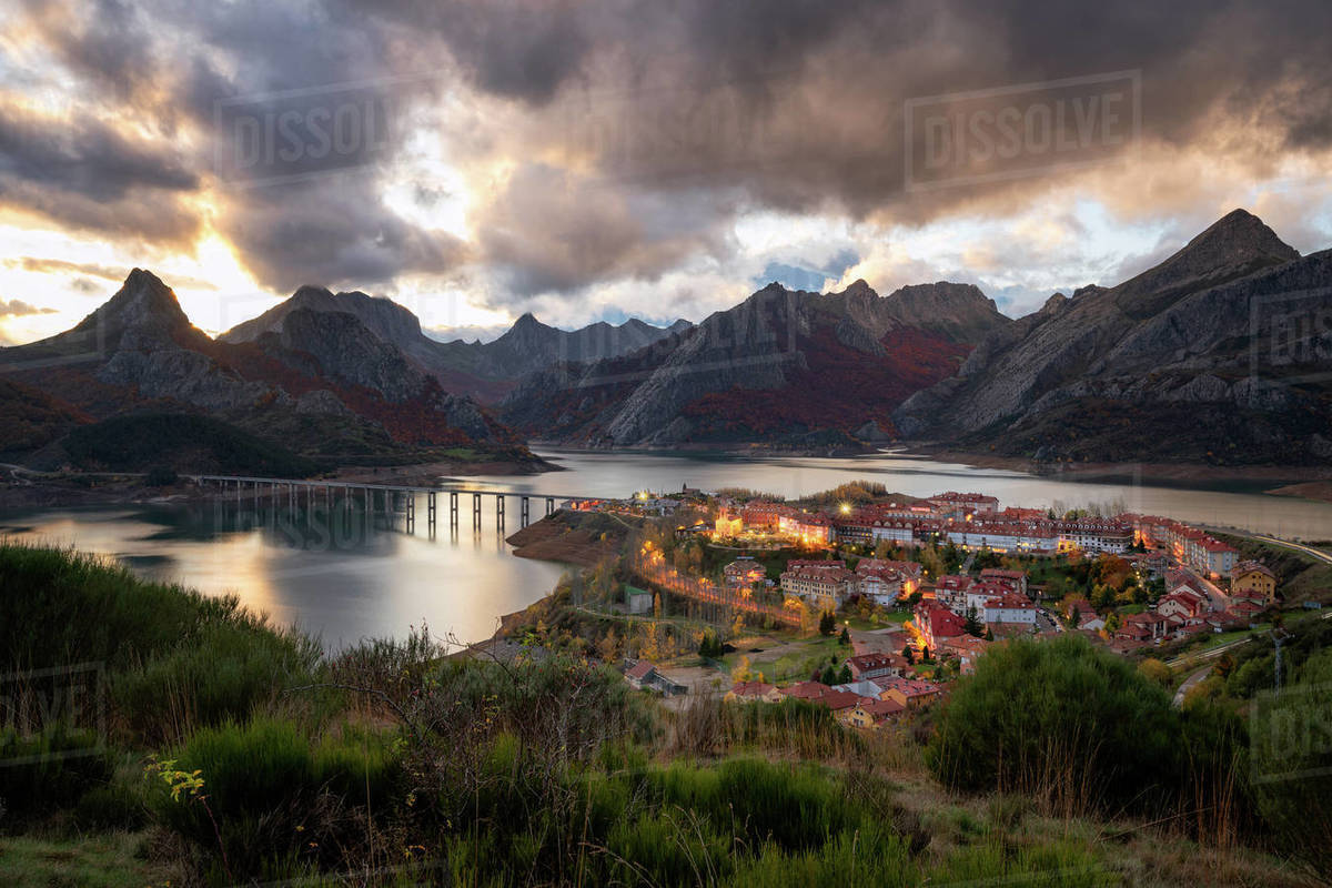 Riano cityscape at sunset with mountain range landscape during Autumn ...