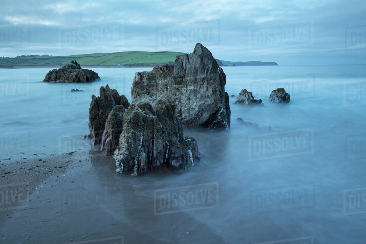 Rocks on beach at low tide at dawn, Bigbury-on-Sea, Devon, England ...