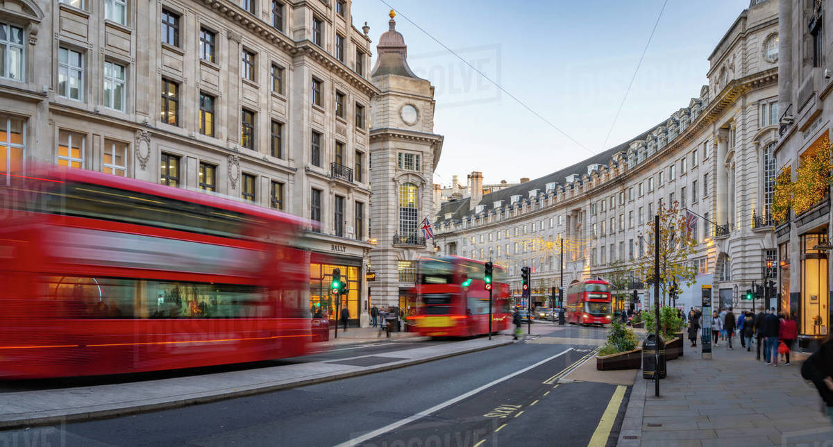 View of red buses and shops on Regent Street at Christmas, London ...