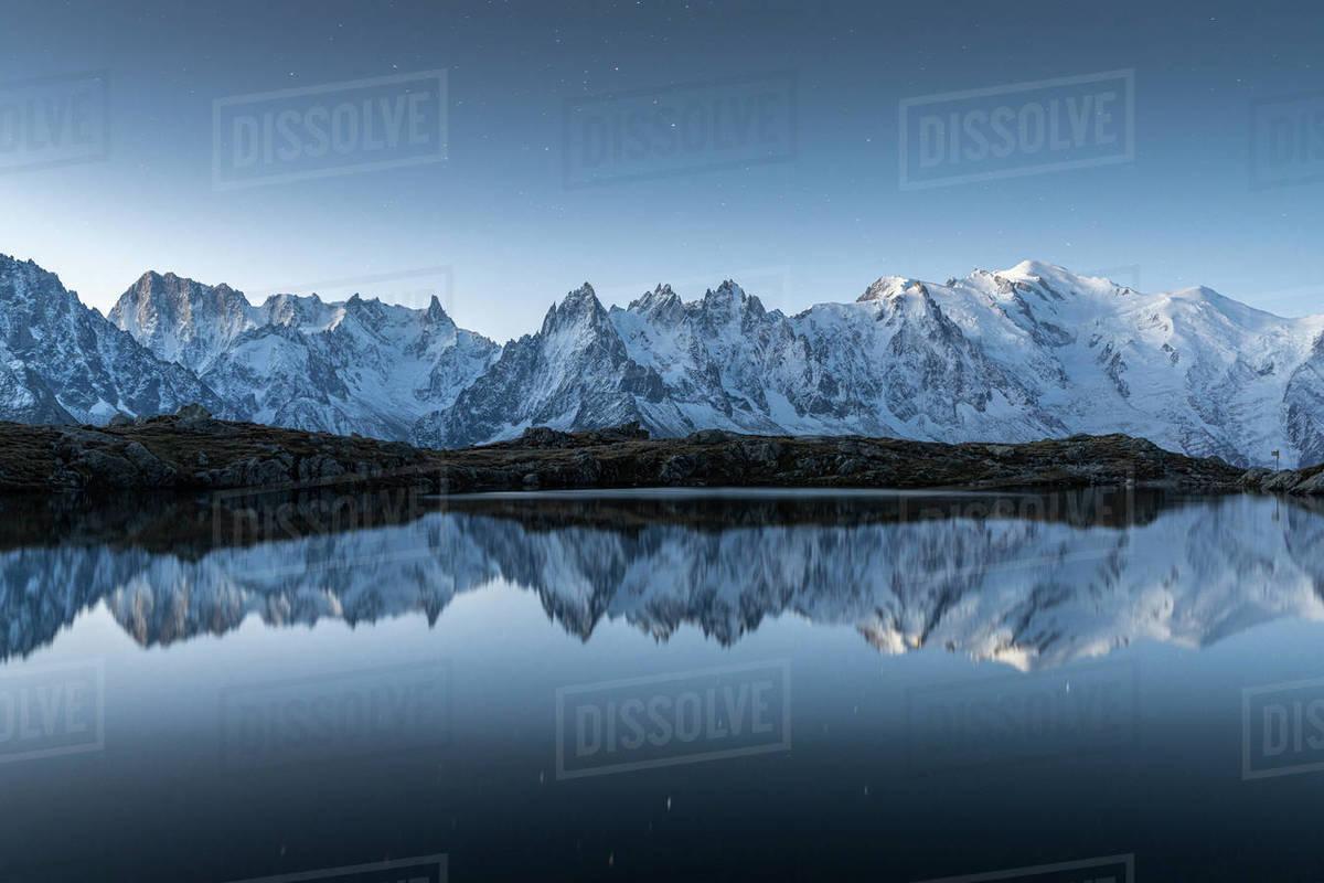 Lacs des Cheserys lake and peaks of Mont Blanc massif covered with snow ...
