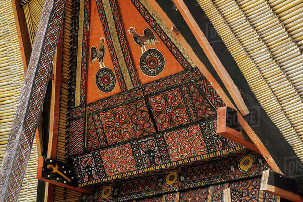 Tongkonan (rice barn) (house) with cockerel and sun motifs at a village ...