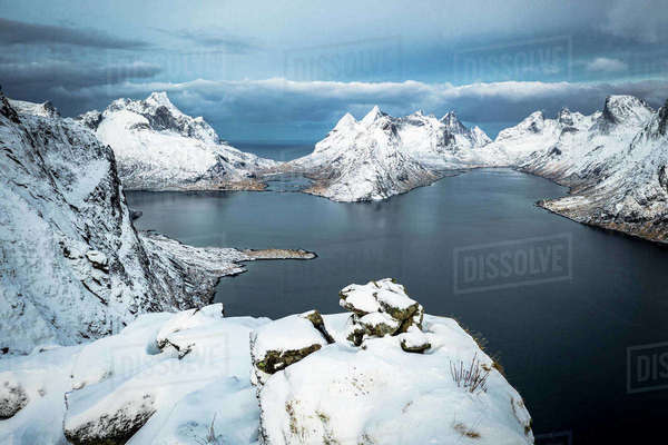 Aerial view of Reine Bay and mountains covered with snow in winter ...