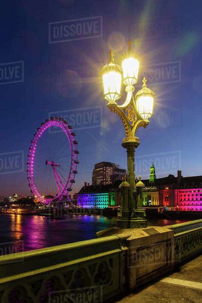 Lamp on Westminster Bridge with London Eye and London Aquarium in ...