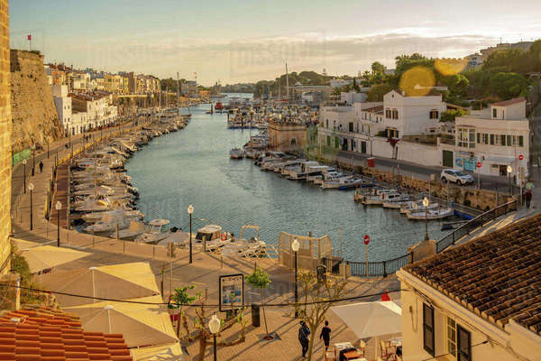 View of marina at golden hour from elevated position, Ciutadella ...
