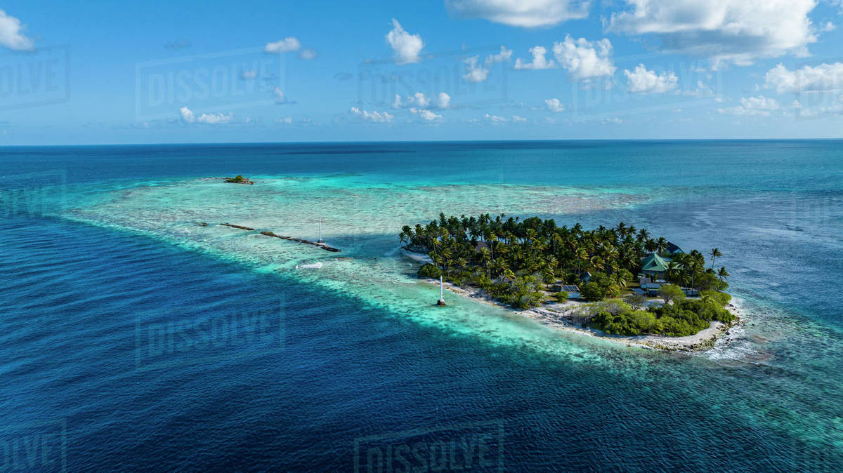 Aerial of the little island at the Avatoru Pass, Rangiroa atoll ...